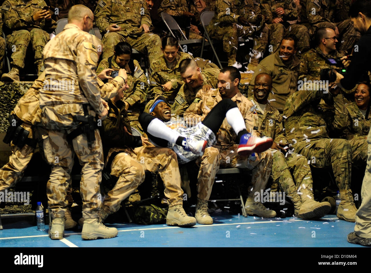 A Globetrotter gag lands “Firefly” Fisher in the laps of surprised ...