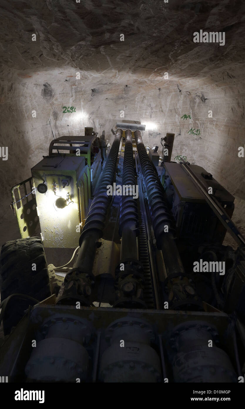 Three drilling machines drive holes for controlled explosions into the ...