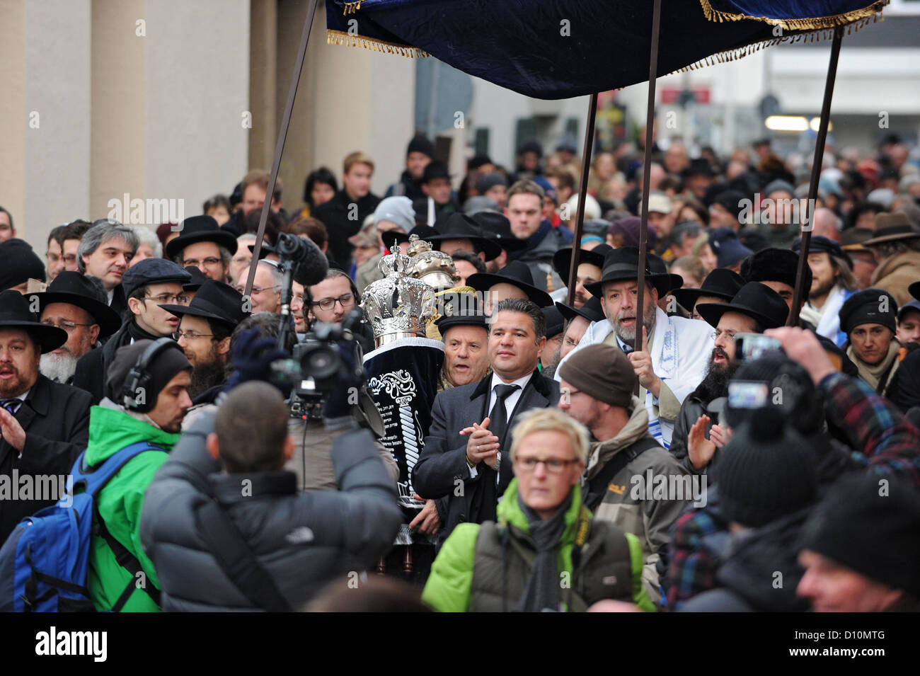 Rabbis carry several Torah scrolls for the inauguration of the new ...