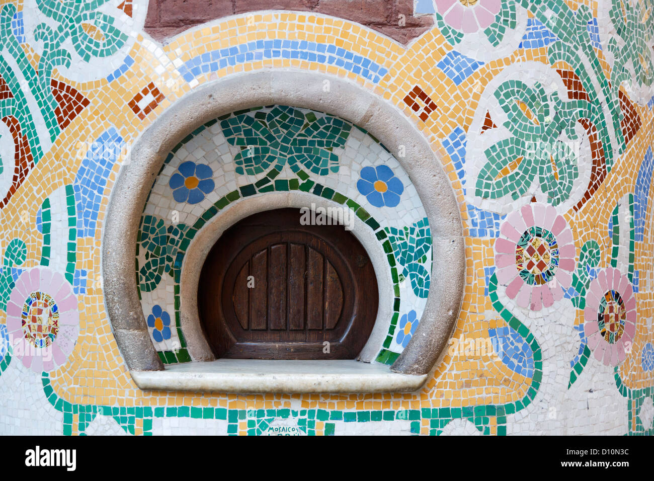 Small closed cashier window surrounded by mosaics, façade of the Palau ...