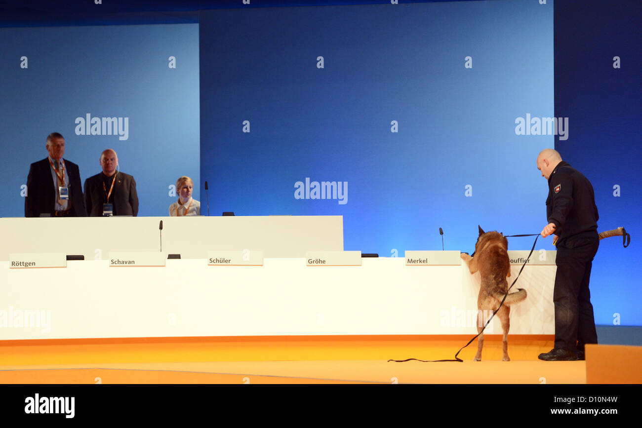 Police officer and his dog inspect the seats prior to Christian ...