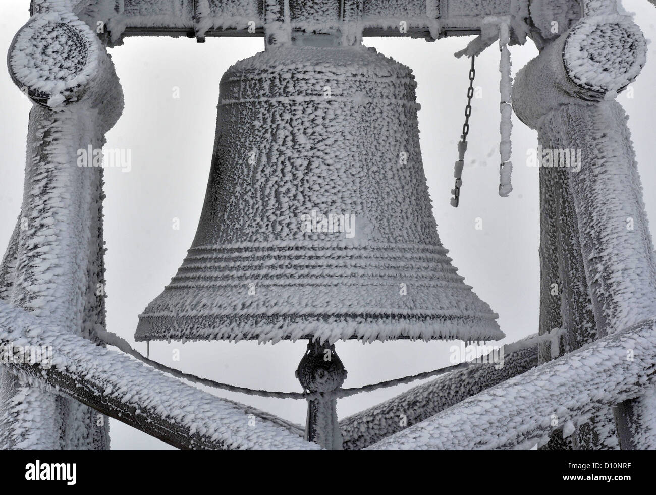 Ice and snow covers the 'Friedensglocke' (peace bell) in a white ...