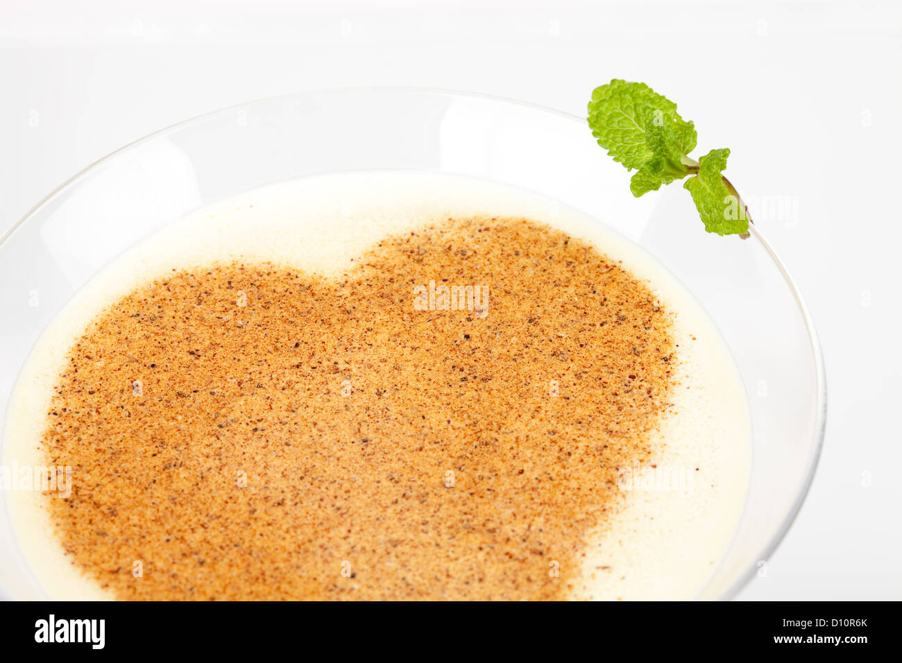 Milk alcohol cocktail with heart decoration isolated on white ...