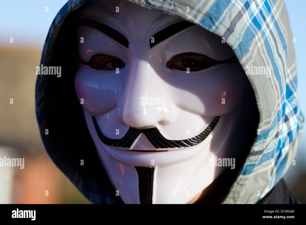 Young man wearing anonymous mask hi-res stock photography and images ...