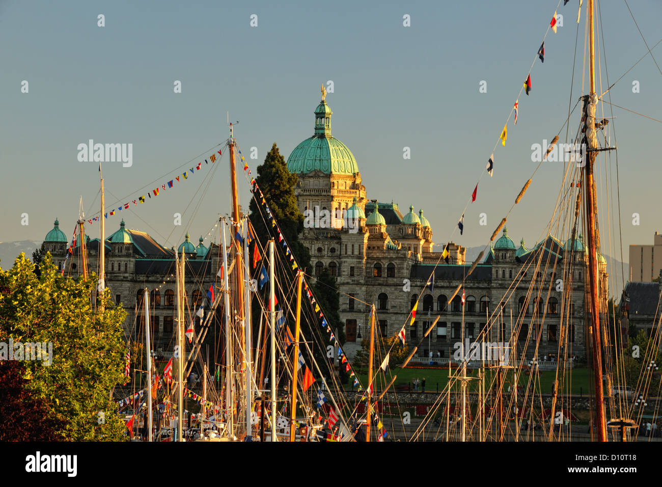 Victoria Inner Harbour and Parliament buildings at dusk with masts of ...