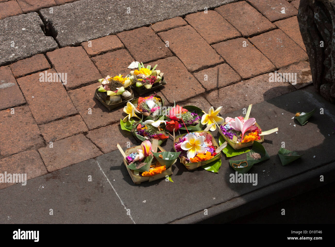 flower offerings in front of entrance on Bali Stock Photo - Alamy