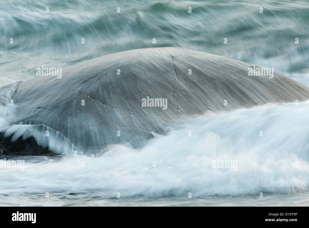 Sea water flowing over a smooth cliff in the sea Stock Photo - Alamy