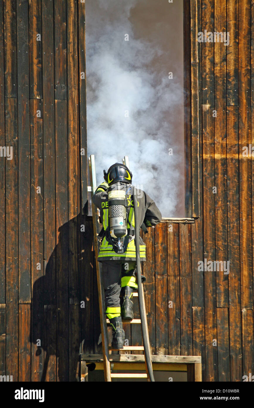 firefighter engaged in the rescue and firefighting Stock Photo - Alamy