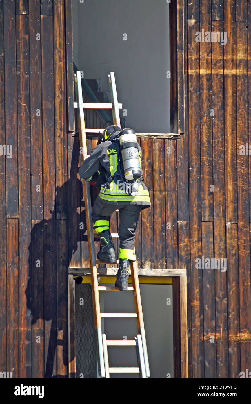 firefighter engaged in the rescue and firefighting Stock Photo - Alamy