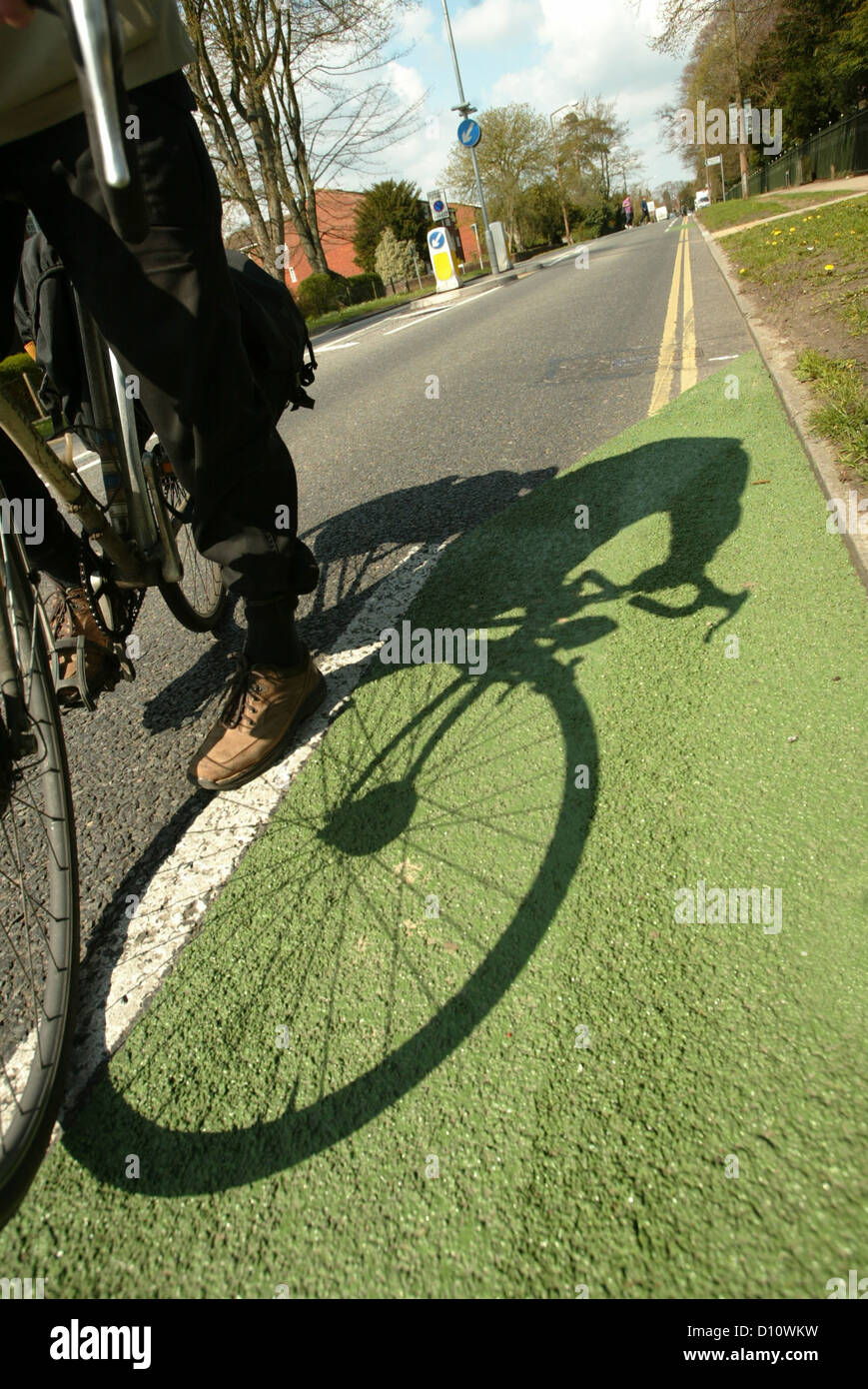 cycle cyclist path green safe safety road shadow Stock Photo - Alamy