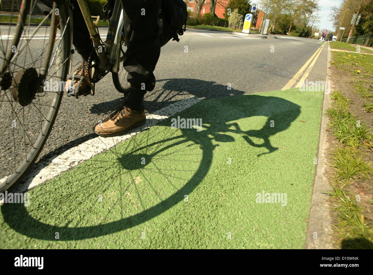 cycle cyclist path shadow wheel spoke spokes road safety Stock Photo ...
