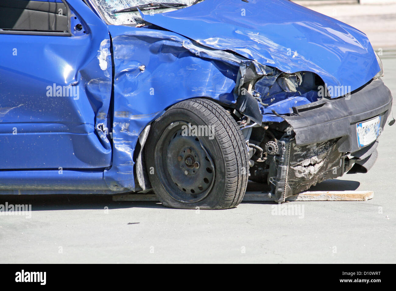wheel of a blue car destroyed in a traffic accident Stock Photo - Alamy