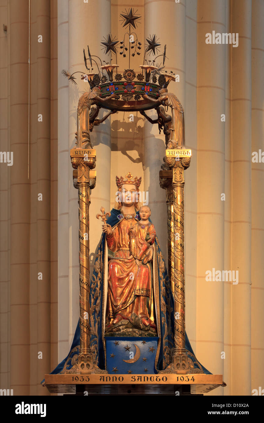Wood carved religious statue of Maria holding Jesus inside the Church ...
