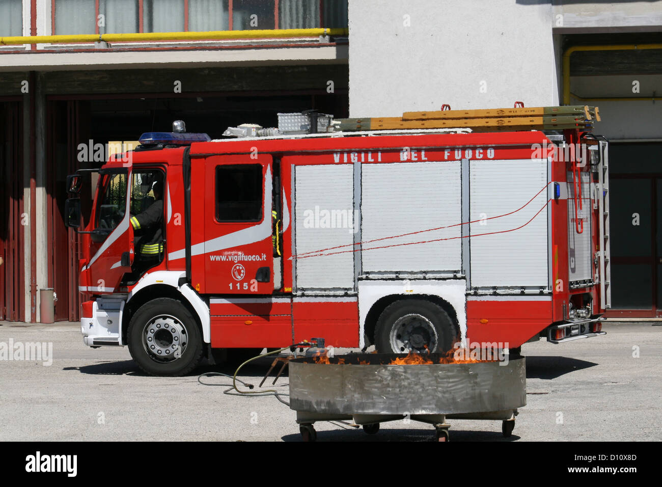 italian firetruck during an exercise to extinguish a simulated fire ...