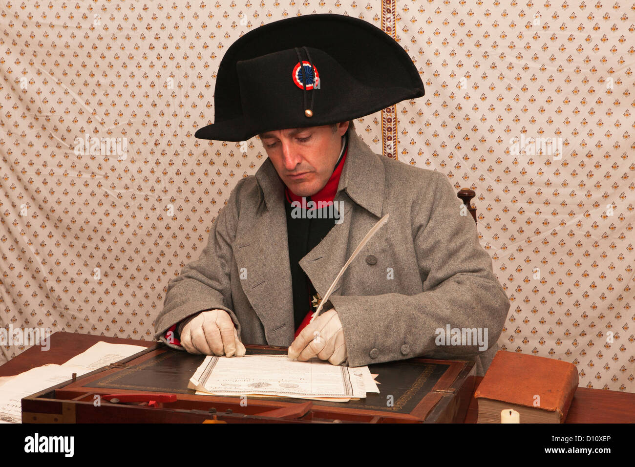 Napoleon Bonaparte signing documents inside his tent at the eve of the ...