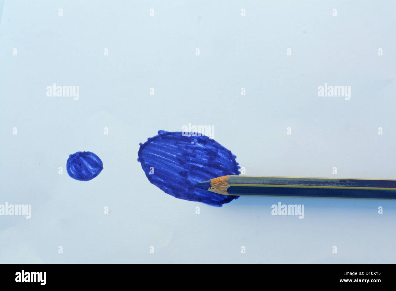 blue point and pencil by little child Stock Photo - Alamy