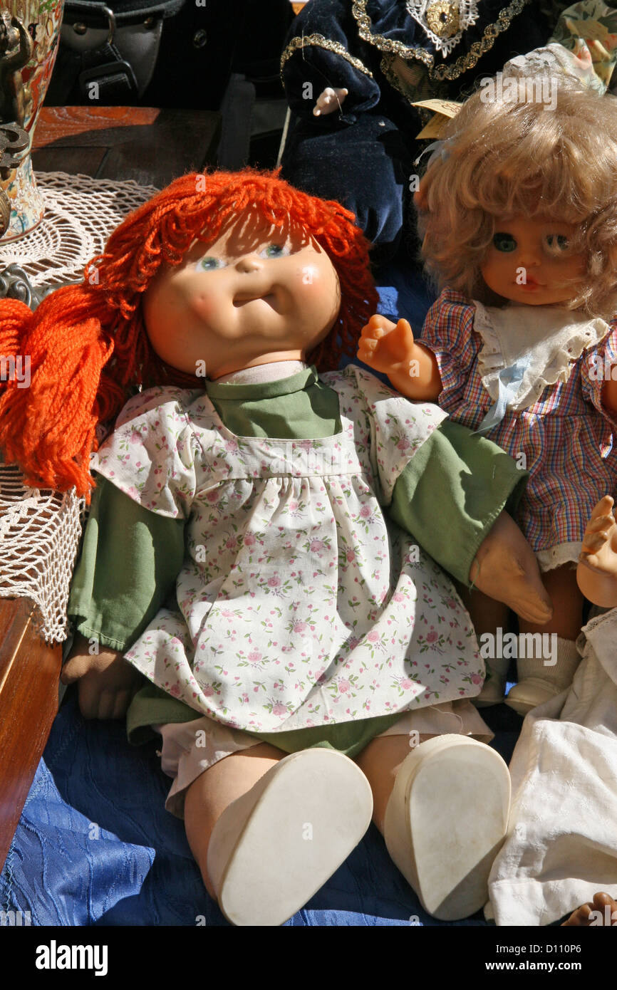 ancient games for girls and doll with hair red wool Stock Photo - Alamy