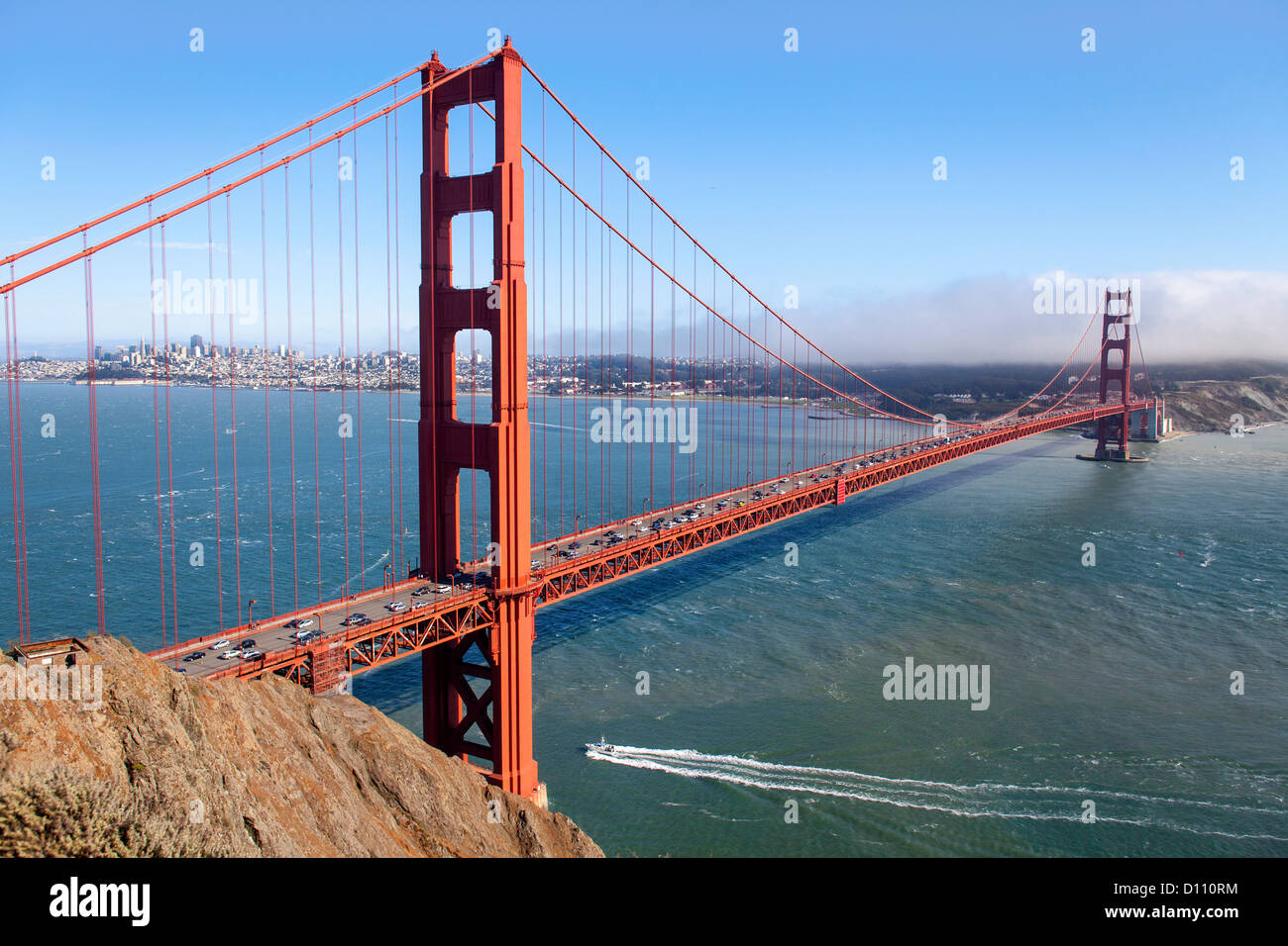 The San Francisco Golden Gate Bridge, pedestrians walking across the ...