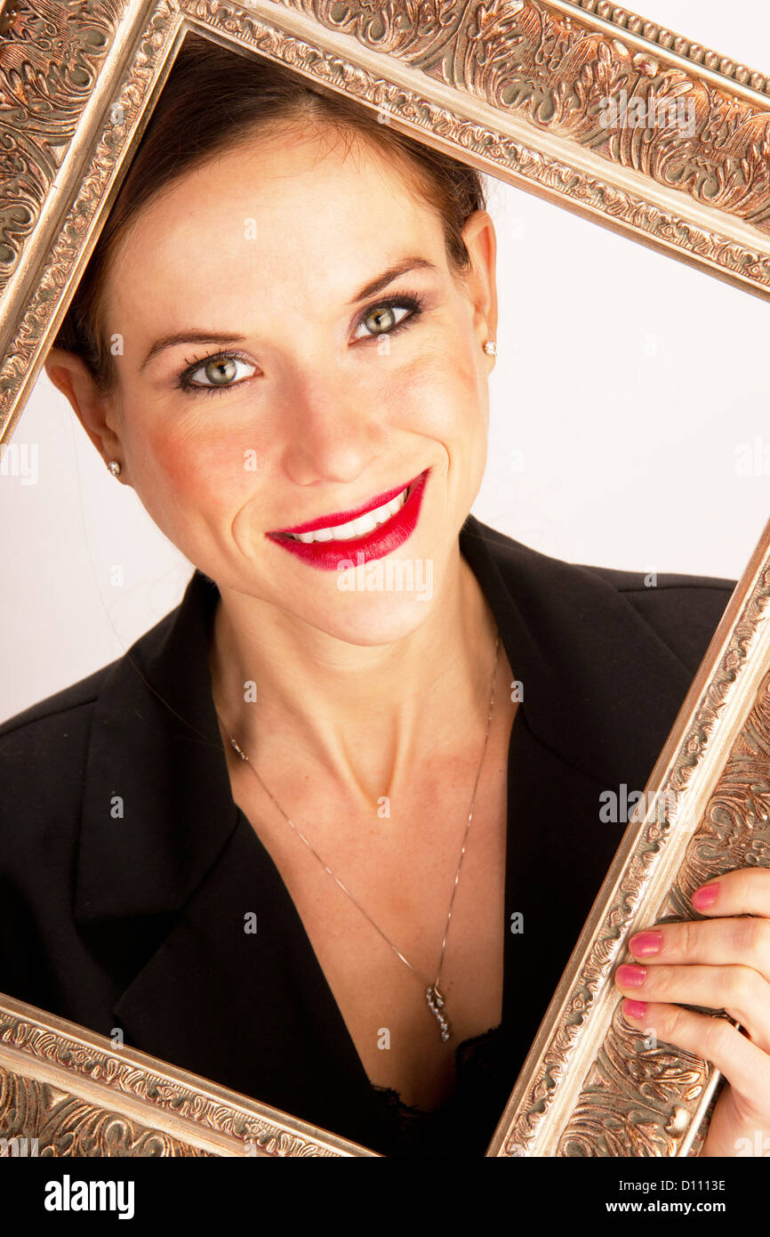 A beautiful brunette has a frame over her head Stock Photo - Alamy