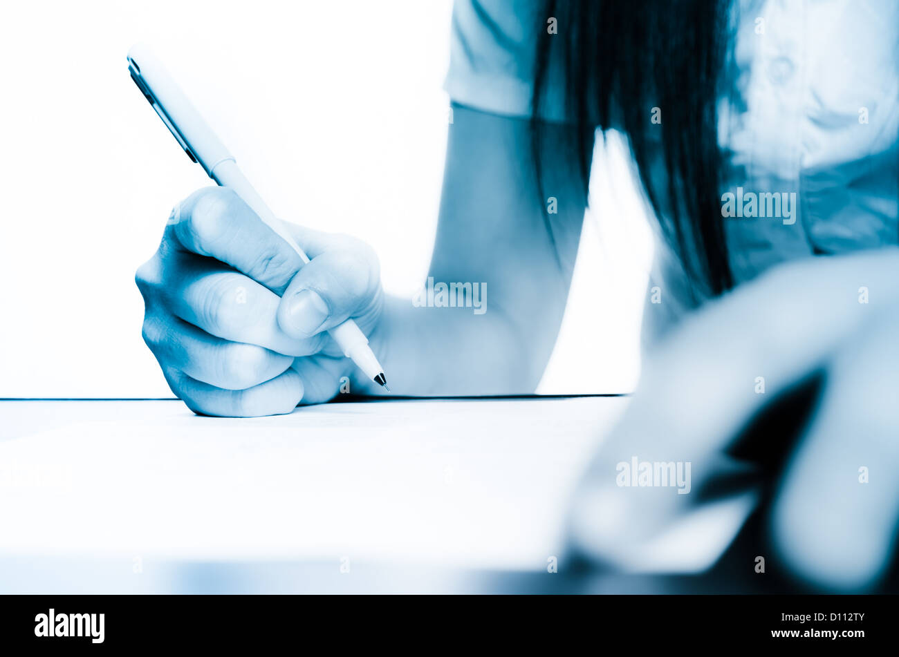 Asian business women endorse on paper contract Stock Photo - Alamy