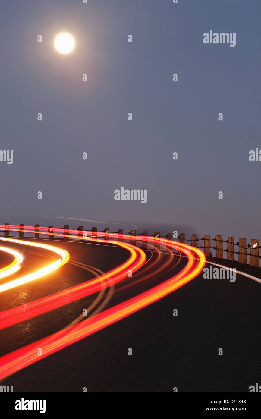 Full Moon Over a Curving Road Stock Photo - Alamy