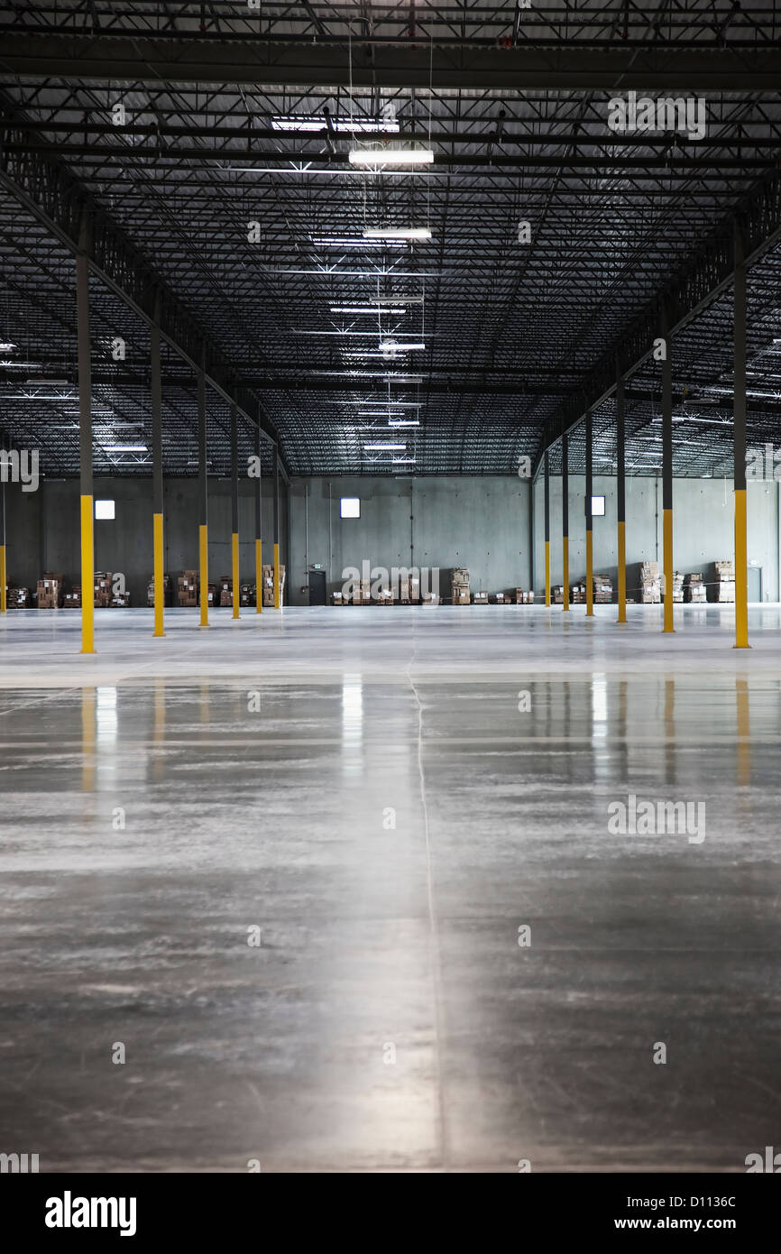 Boxes Against a Wall in a Warehouse Stock Photo - Alamy