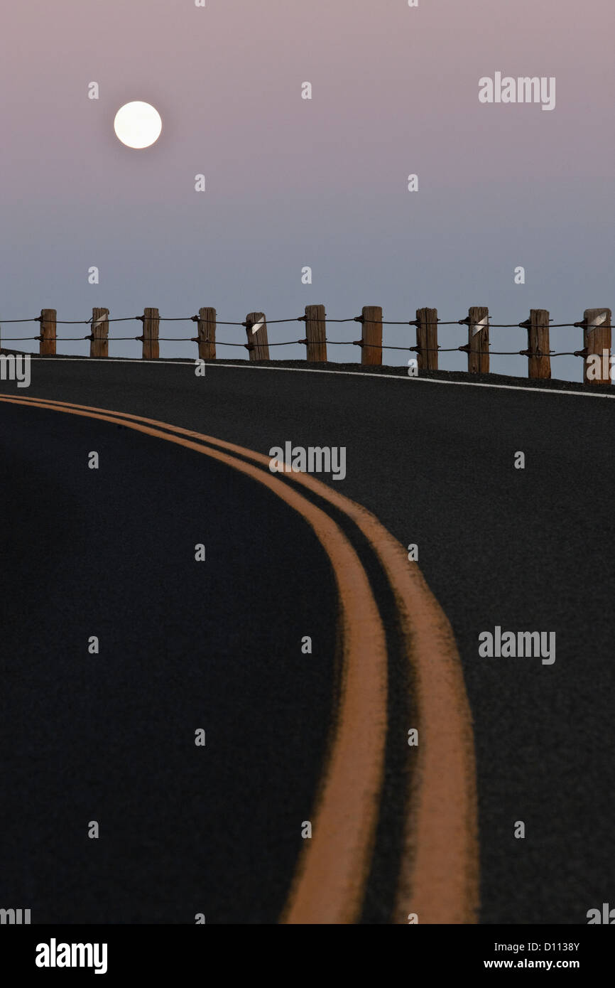 Full Moon Over a Curving Road Stock Photo - Alamy
