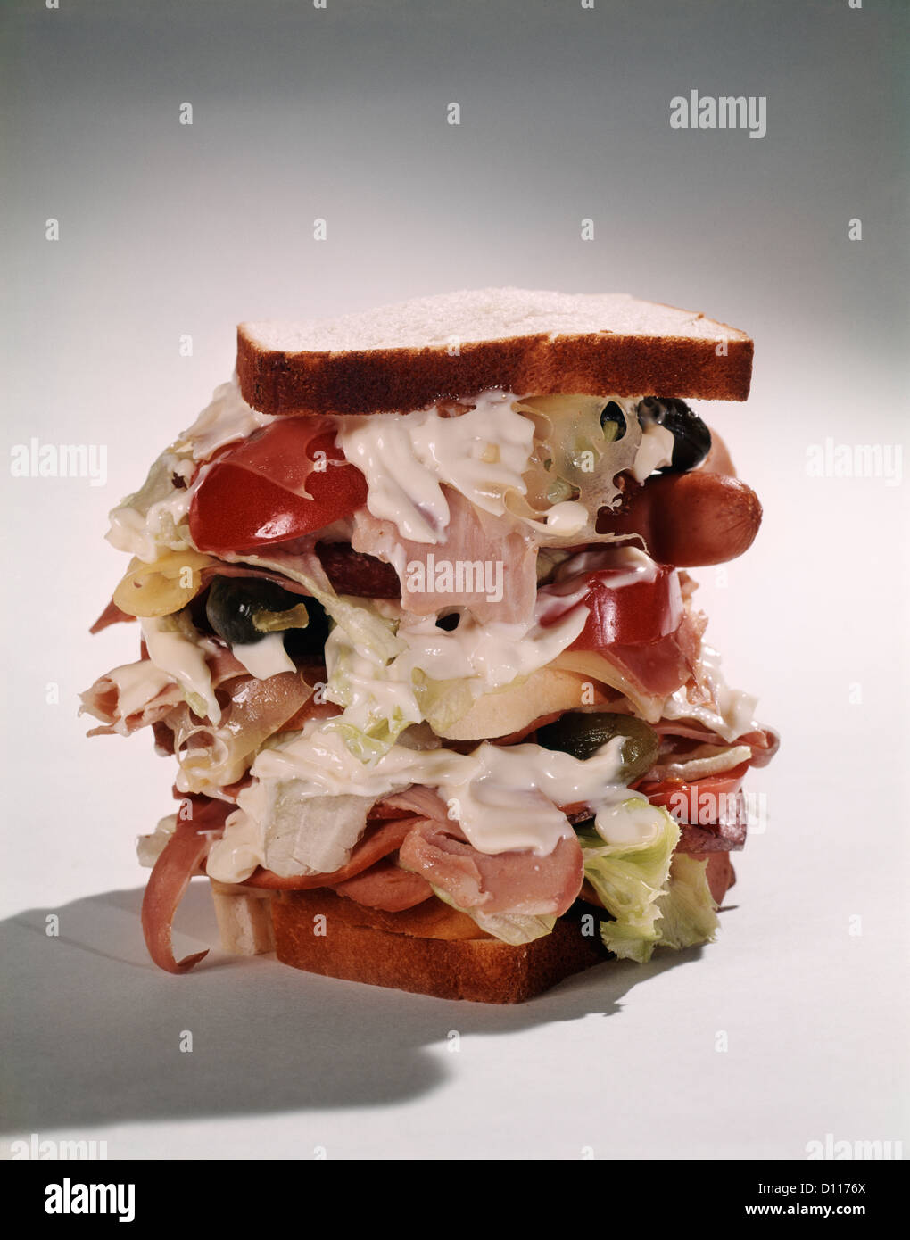 TALL OVERSTUFFED DAGWOOD SANDWICH STILL LIFE Stock Photo - Alamy
