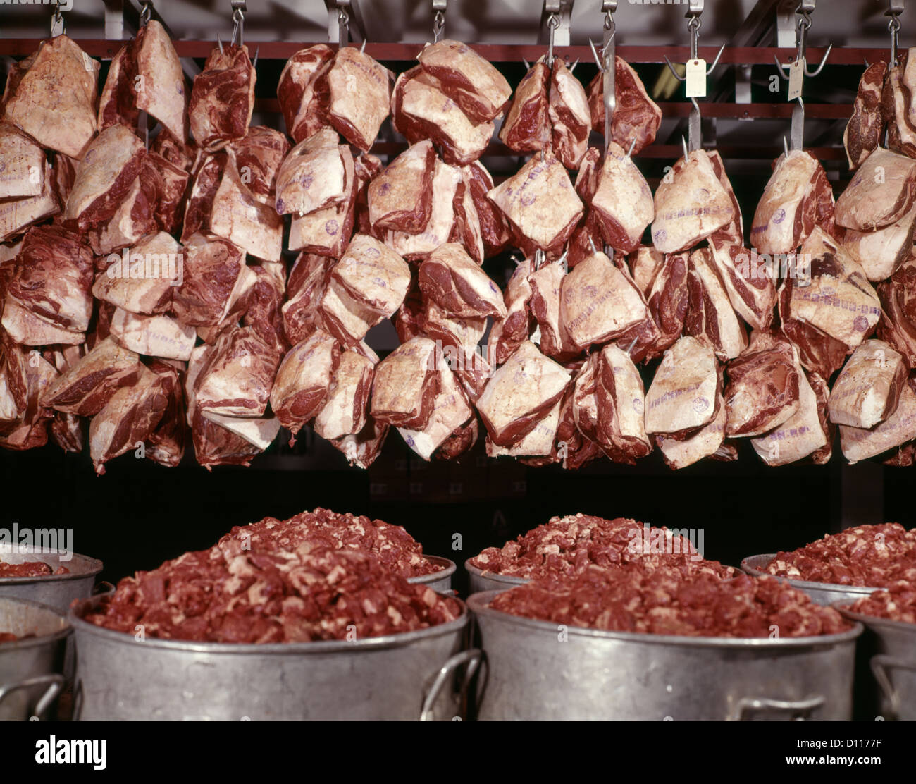 1970s MEAT PACKING PLANT WITH HANGING CUTS AND POTS OF CHOPPED RAW BEEF ...
