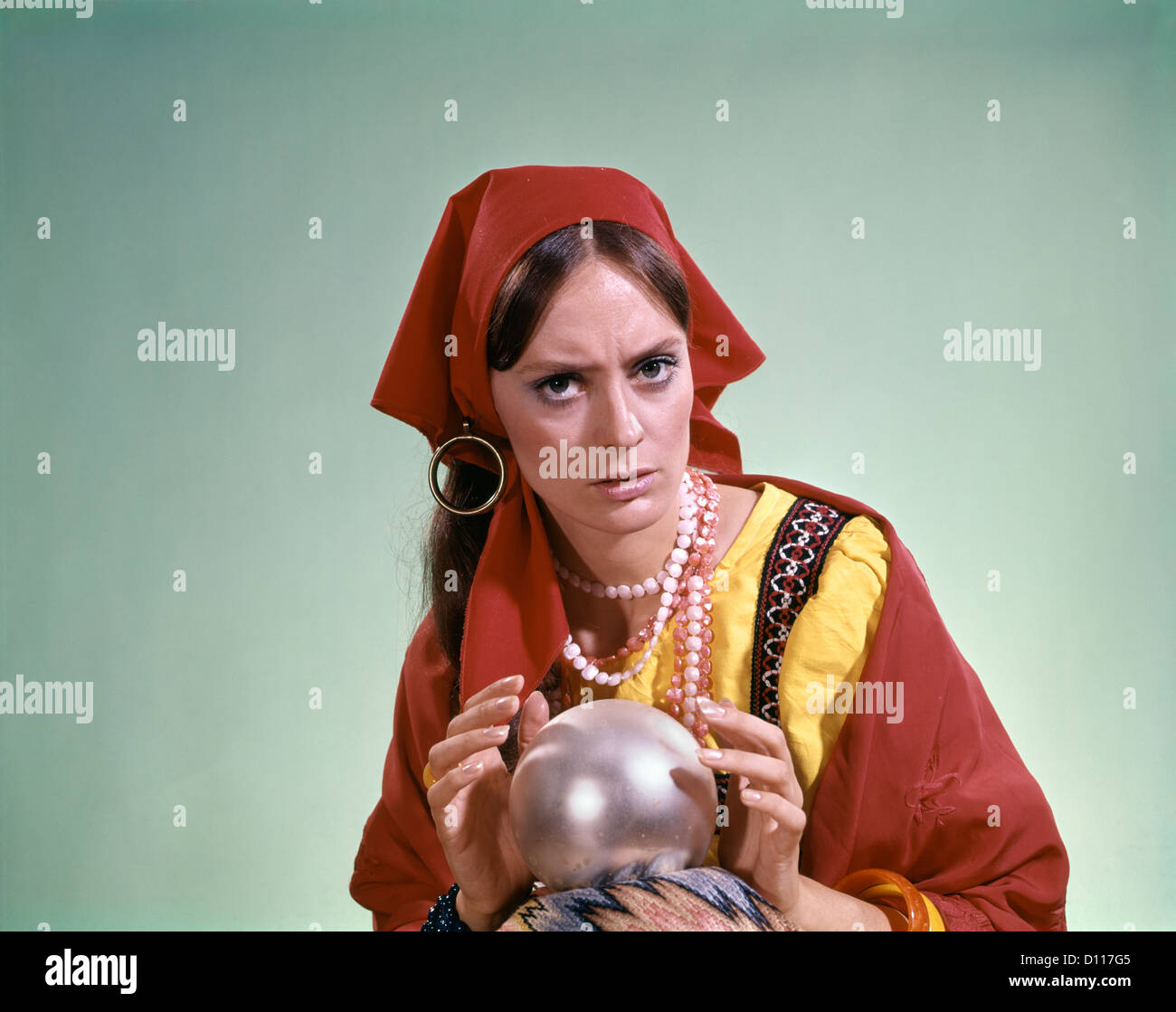 1970s PSYCHIC CRYSTAL BALL FORTUNE TELLER LOOKING AT CAMERA Stock Photo ...