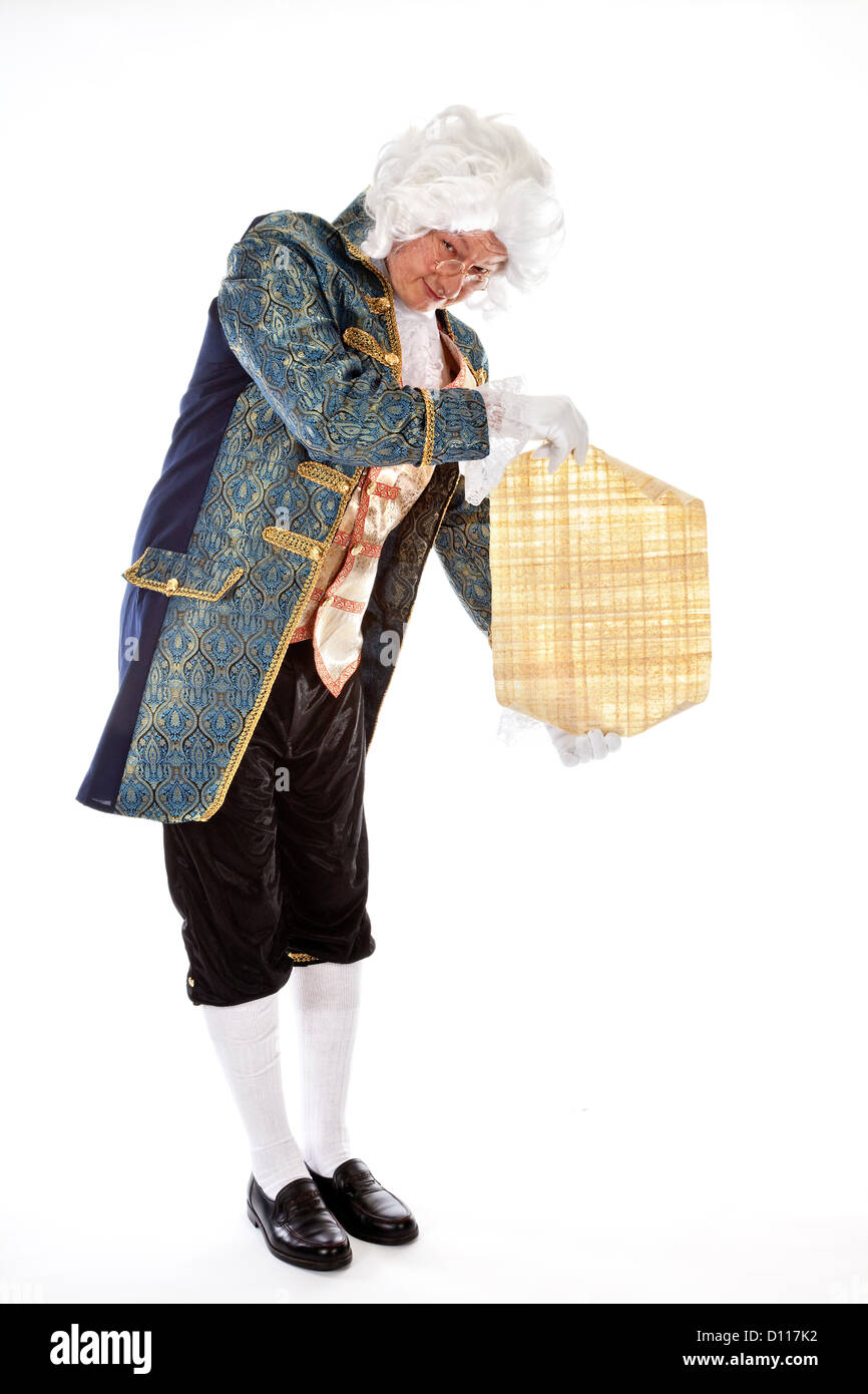 Lackey in victorian livery costume presenting a message on parchment ...