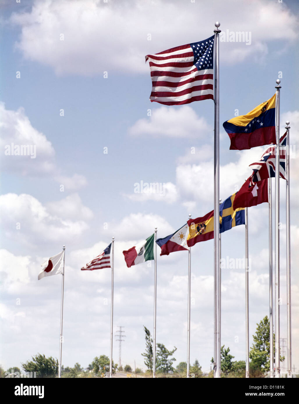 1960s INTERNATIONAL FLAGS WITH PROMINENT AMERICAN FLAG IN FOREGROUND ...