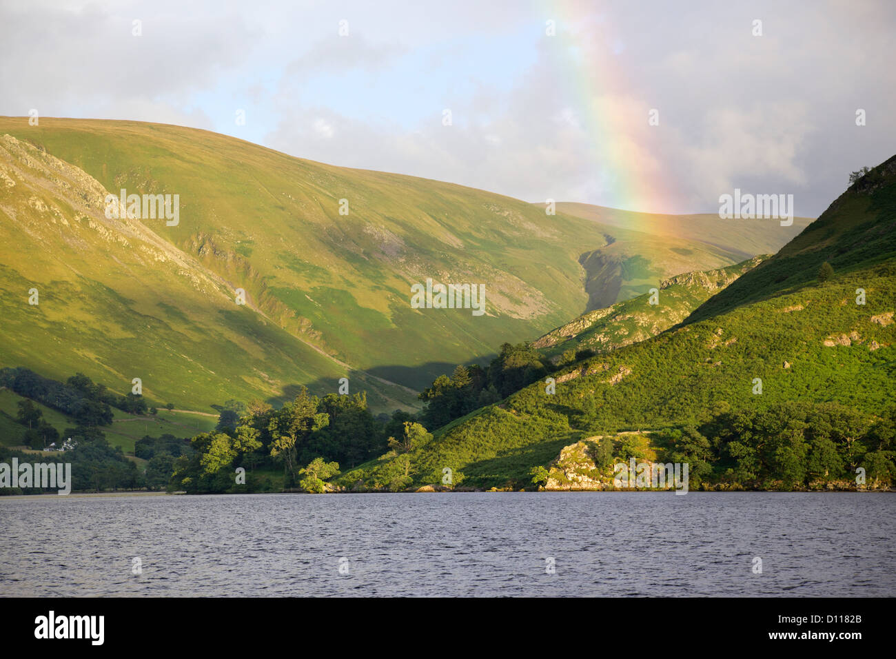 A rainbow provides a scenic backdrop to Ullswater, near Howtown Jetty ...