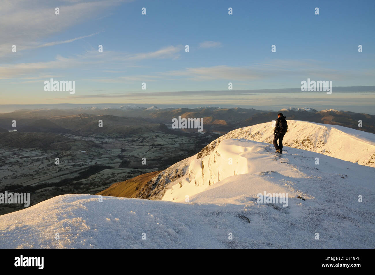 Walker admiring the view from the summit of Gategill Fell on Blencathra ...