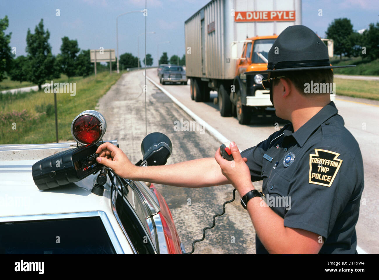 Policeman operating speed radar hi-res stock photography and images - Alamy