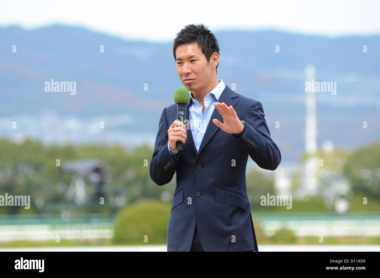 Japanese racing driver Kamui Kobayashi speaks during a special ...
