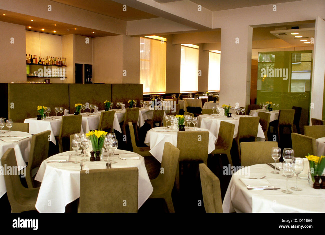 Interior of restaurant depicting bar and dressed tables Stock Photo - Alamy