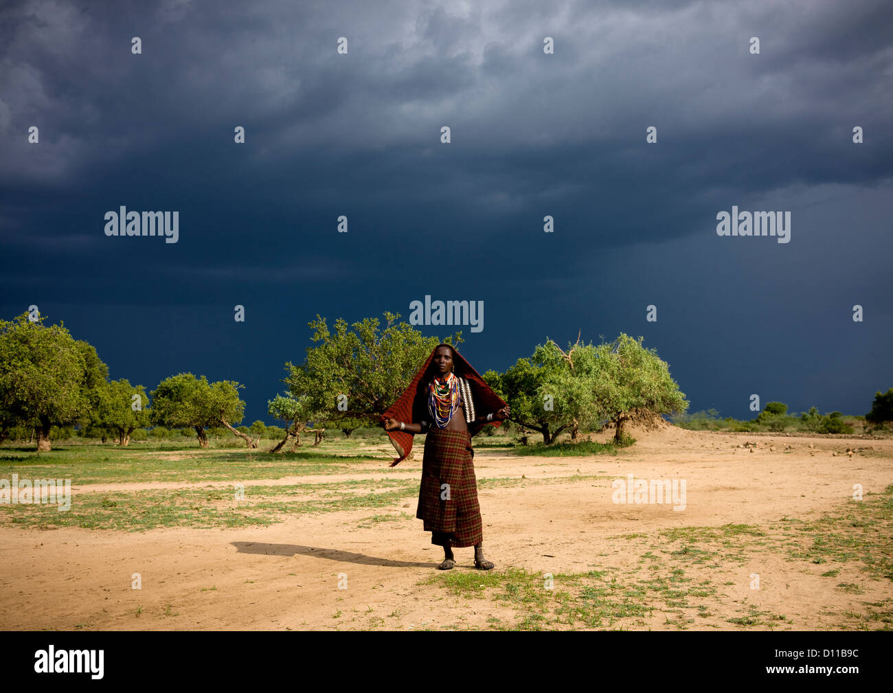 Erbore Tribe Woman Under A Stormy Sky, Weito, Omo Valley, Ethiopia ...