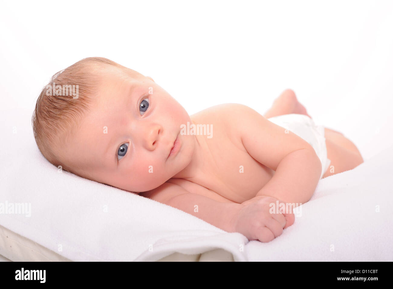 Cute baby laying on side Stock Photo - Alamy