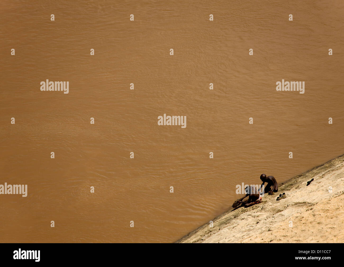 Aerial View Of Karo Kids Washing In Omo River, Korcho Village, Ethiopia ...