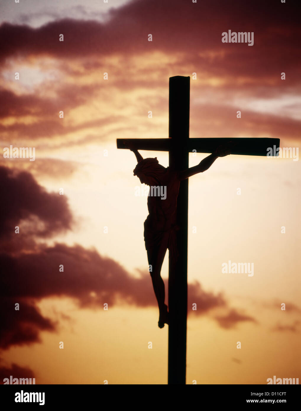 CRUCIFIX JESUS CHRIST ON THE CROSS SILHOUETTED AGAINST DRAMATIC SKY ...