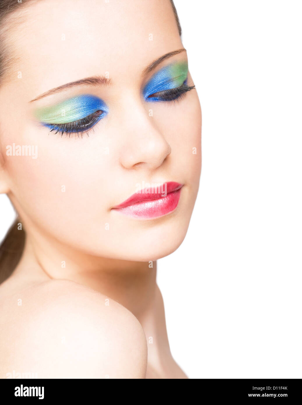 Beautiful young woman in very colorful creative makeup Stock Photo - Alamy