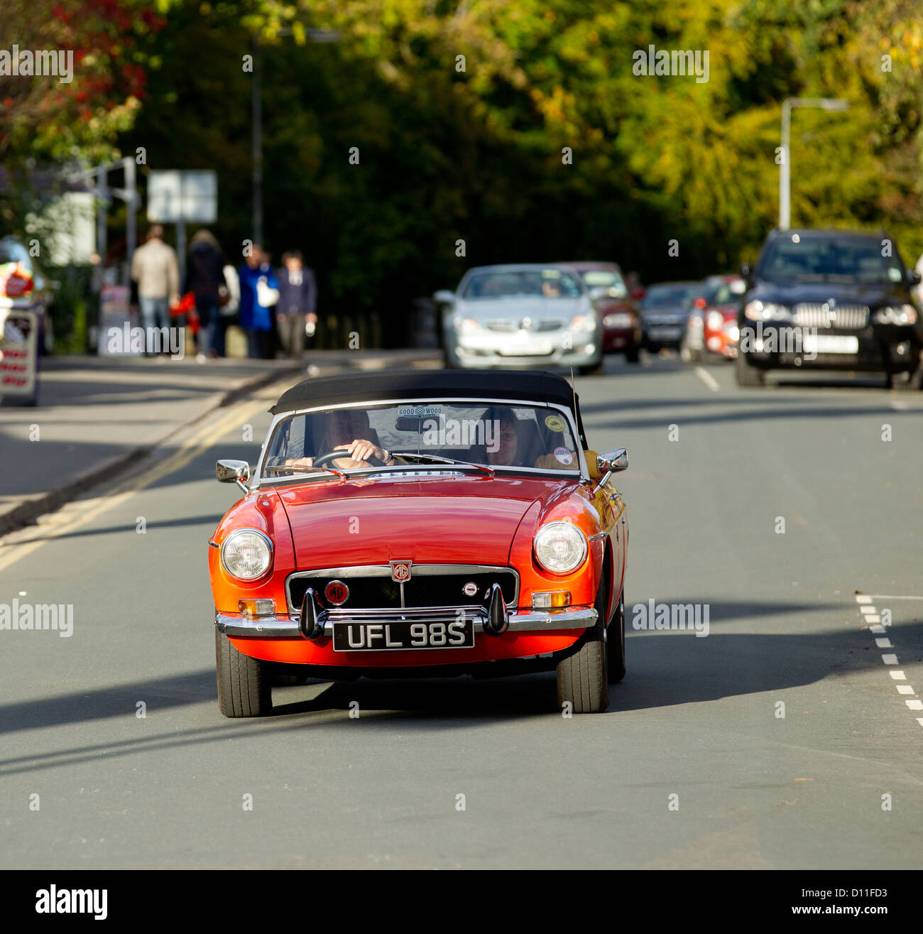 old vintage red MG soft top sports car & badge Stock Photo - Alamy