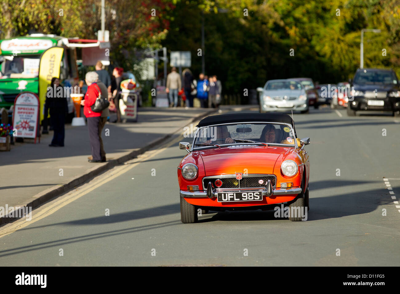 old vintage red MG soft top sports car & badge Stock Photo - Alamy
