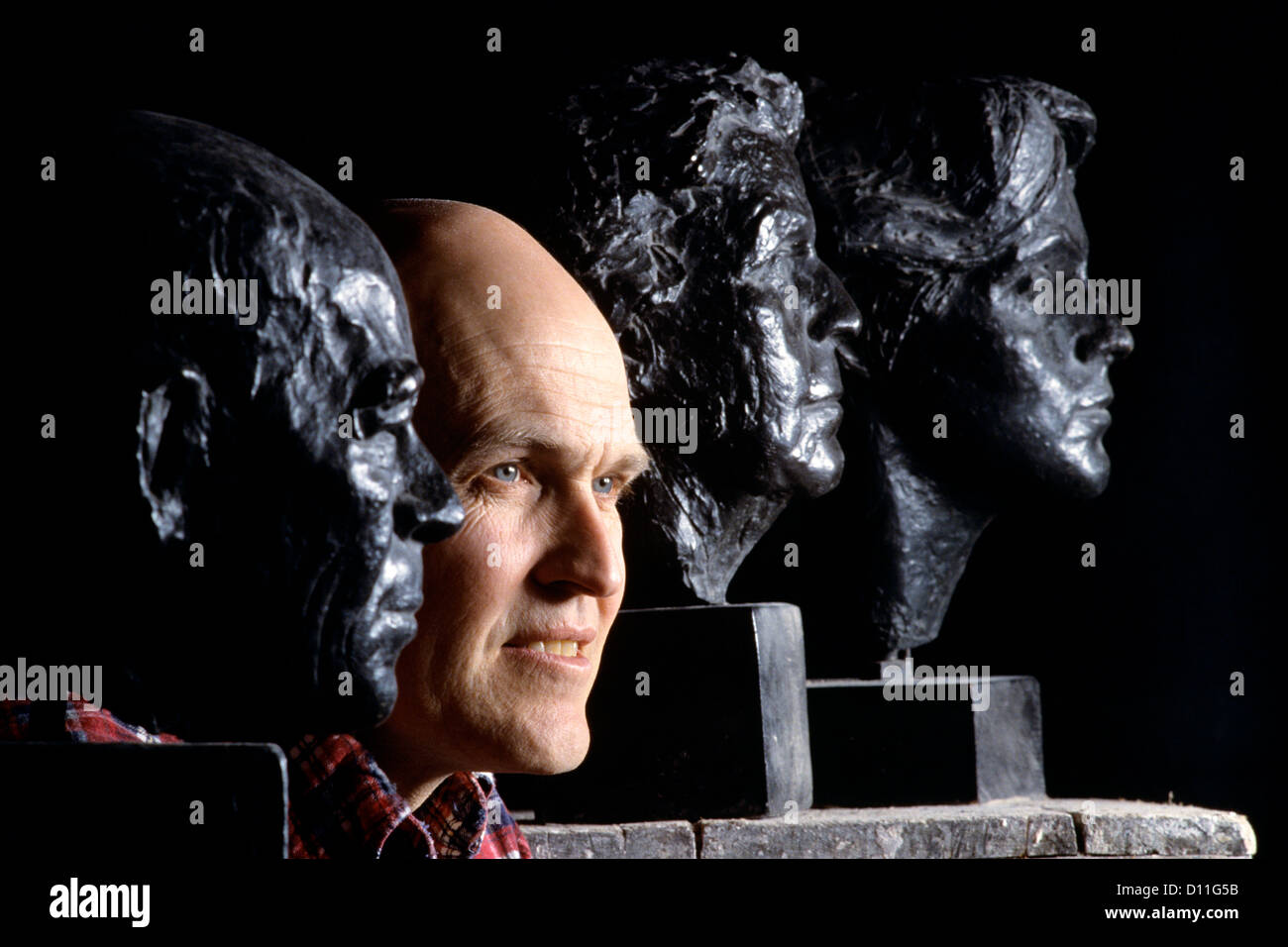 1980s PORTRAIT SMILING MAN SCULPTOR ARTIST WITH SCULPTED BUSTS Stock ...