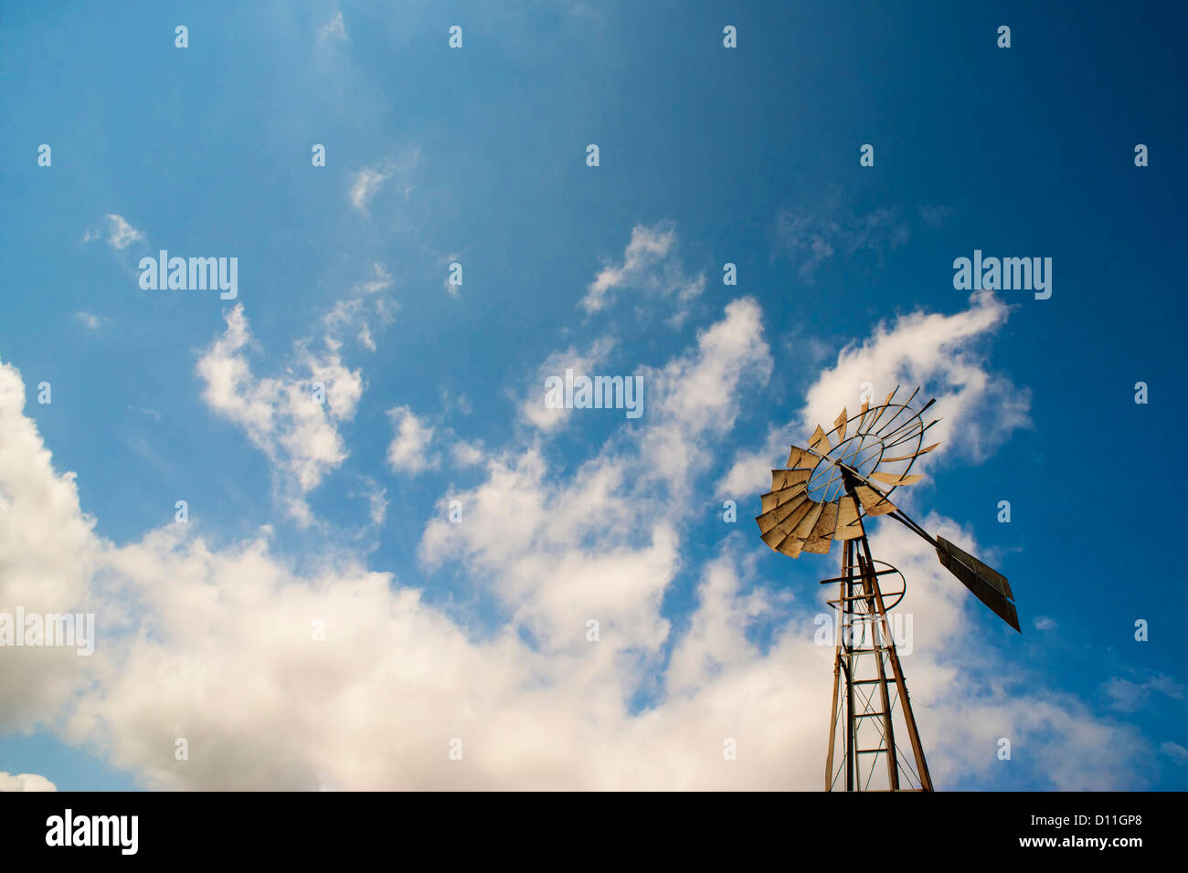 USA, Texas, Ranch windmill with water well pump against sky Stock Photo ...