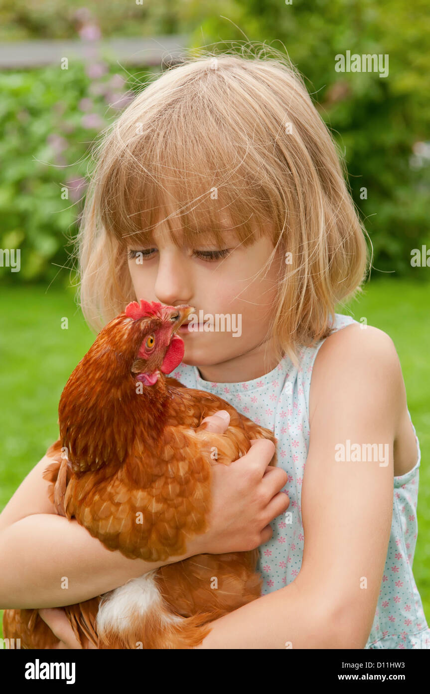 Girl hugging hen hi-res stock photography and images - Alamy