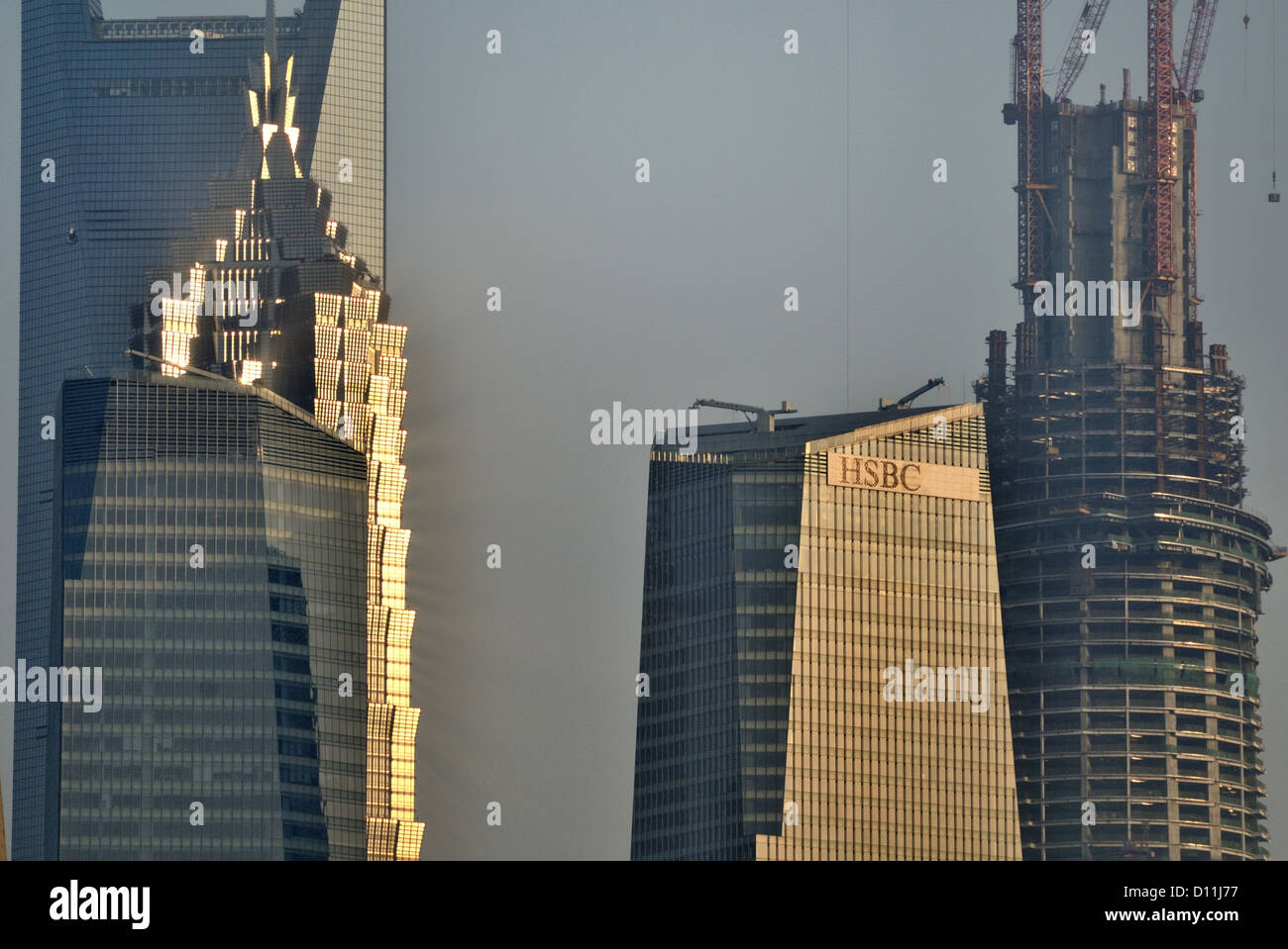 Shanghai modern Financial center Lujiazui at sunset sun reflections ...