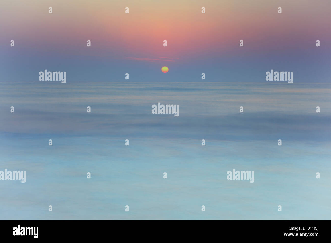 Sun Rising Over Blurred Water; Spain Stock Photo - Alamy