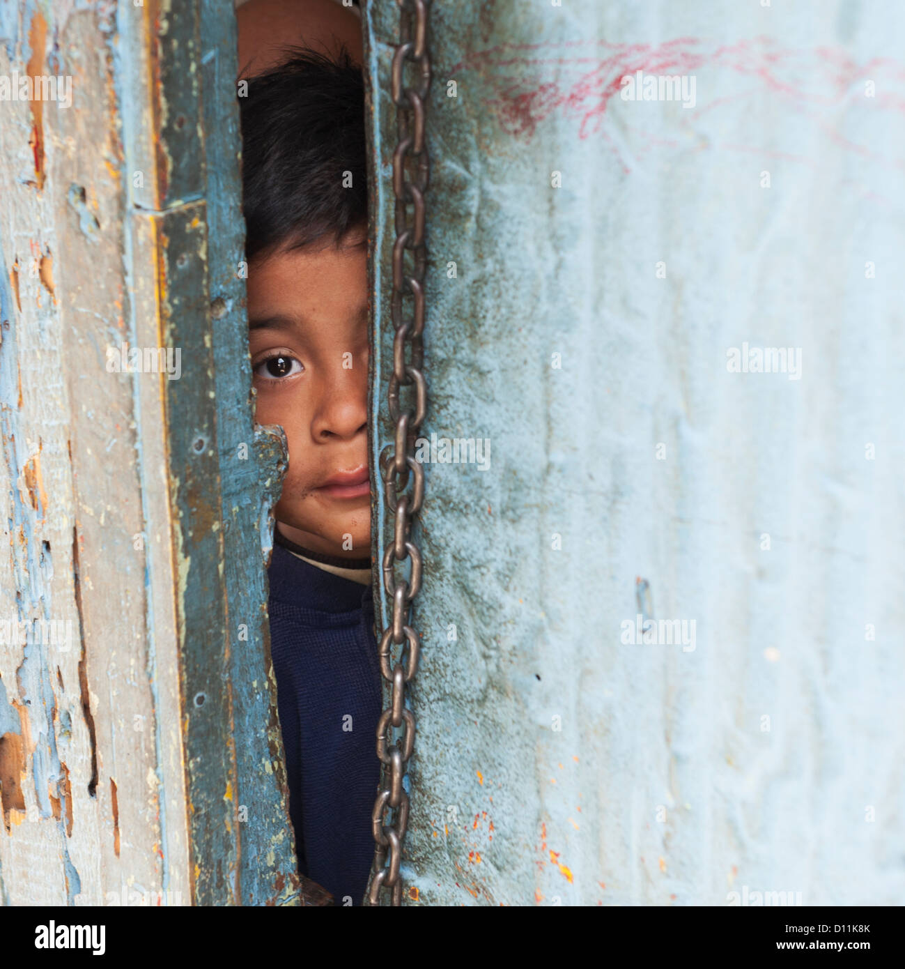 Boy peeking through door. hi-res stock photography and images - Alamy